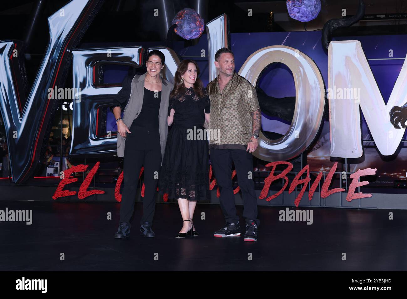 Tom Hardy, Kelly Marcel, and Cristo Fernandez attend the black carpet ...