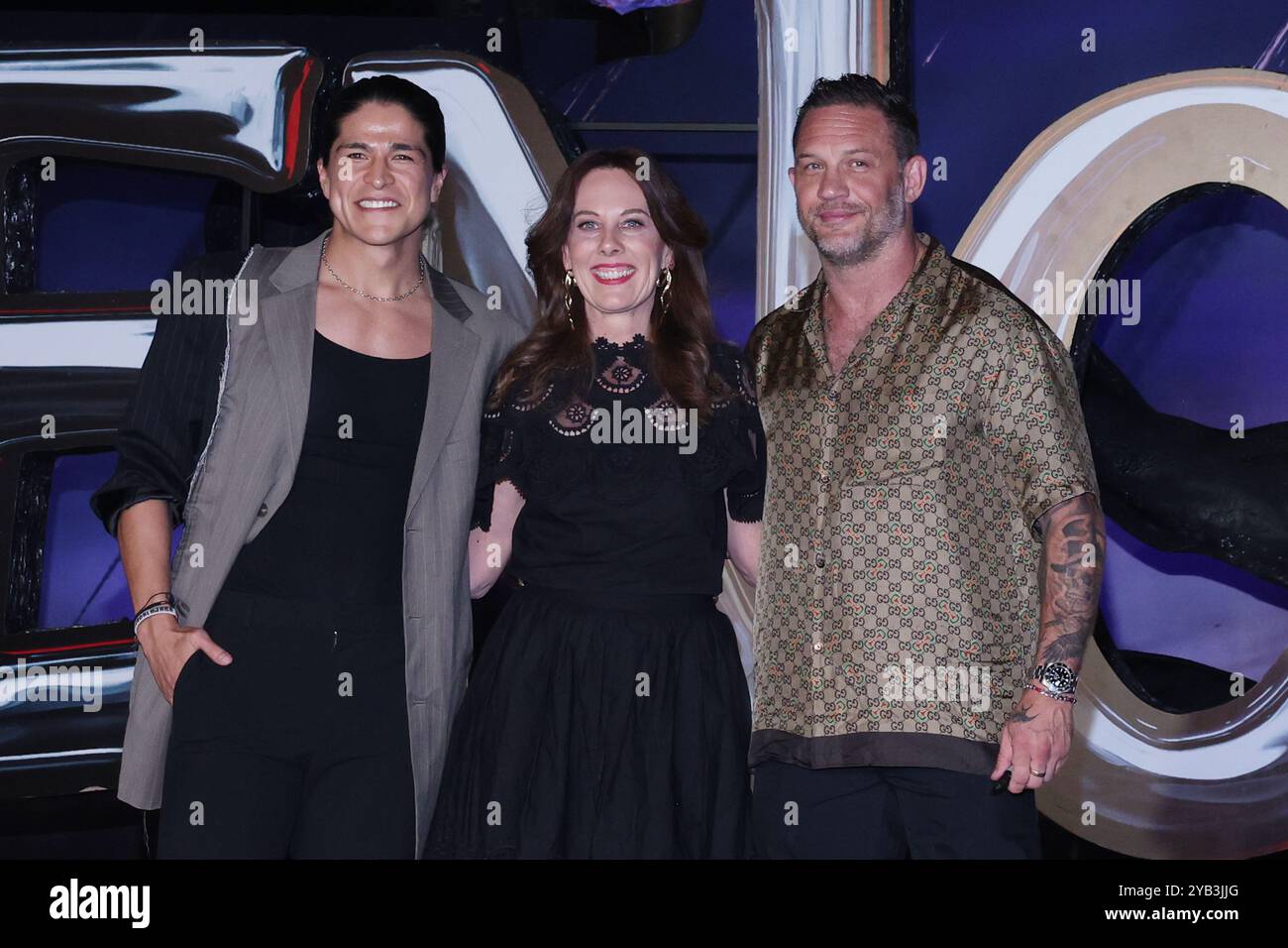 Tom Hardy, Kelly Marcel, and Cristo Fernandez attend the black carpet ...