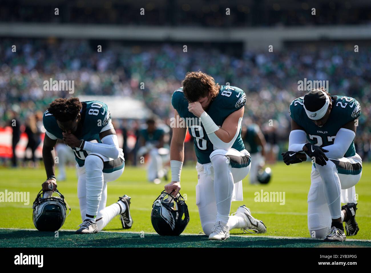 Philadelphia Eagles' Parris Campbell, Jack Stoll and Kelee Ringo kneel ...