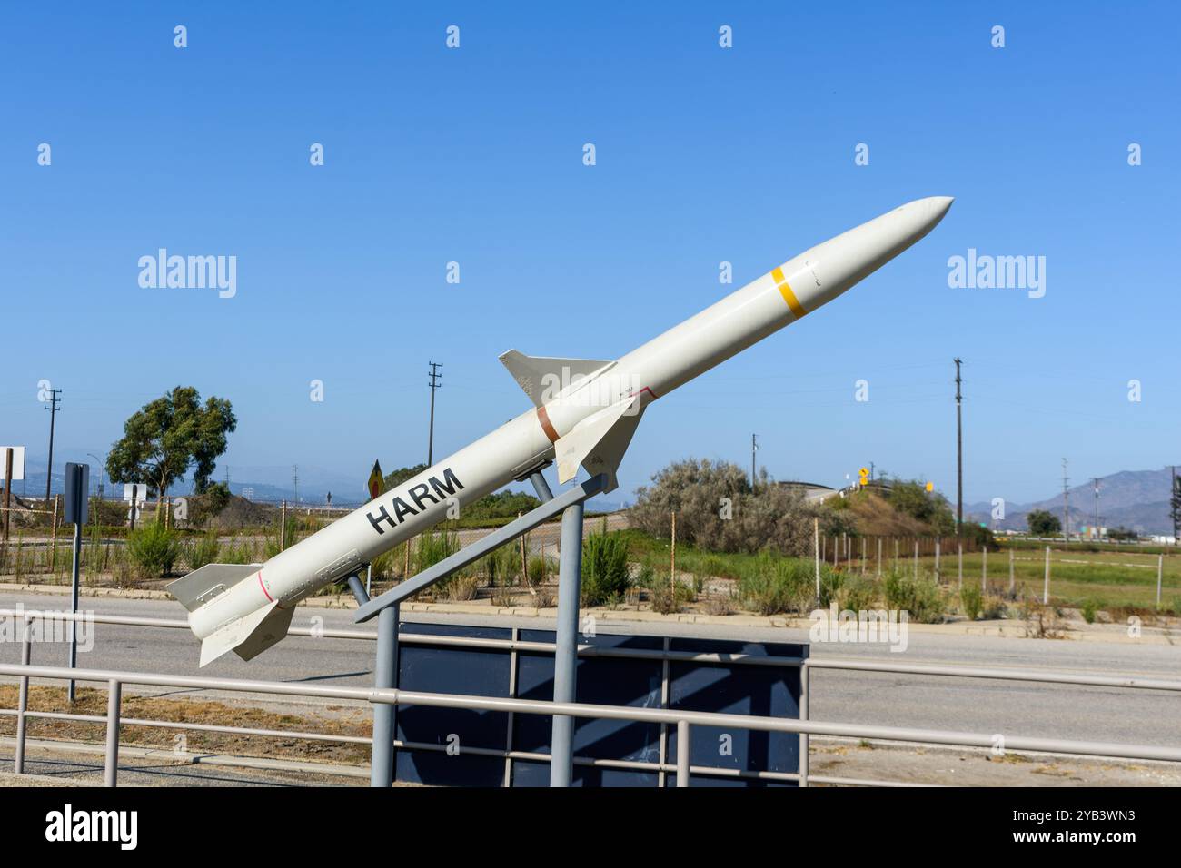 AGM-88 HARM missile is displayed on a stand in an outdoor military ...