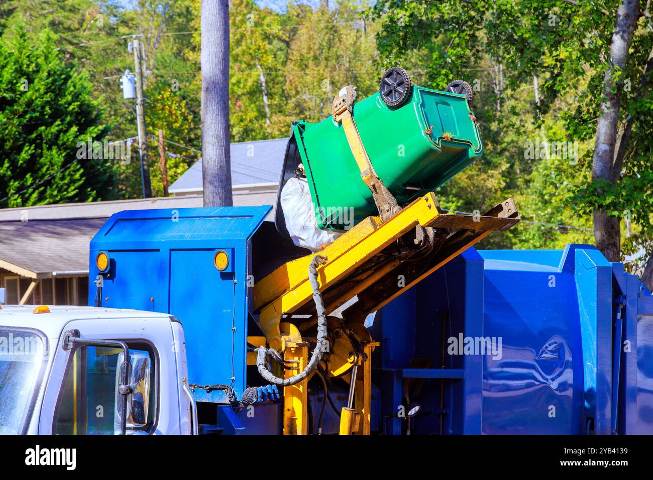 Removal of garbage by municipal cleaning services by loading mixed ...