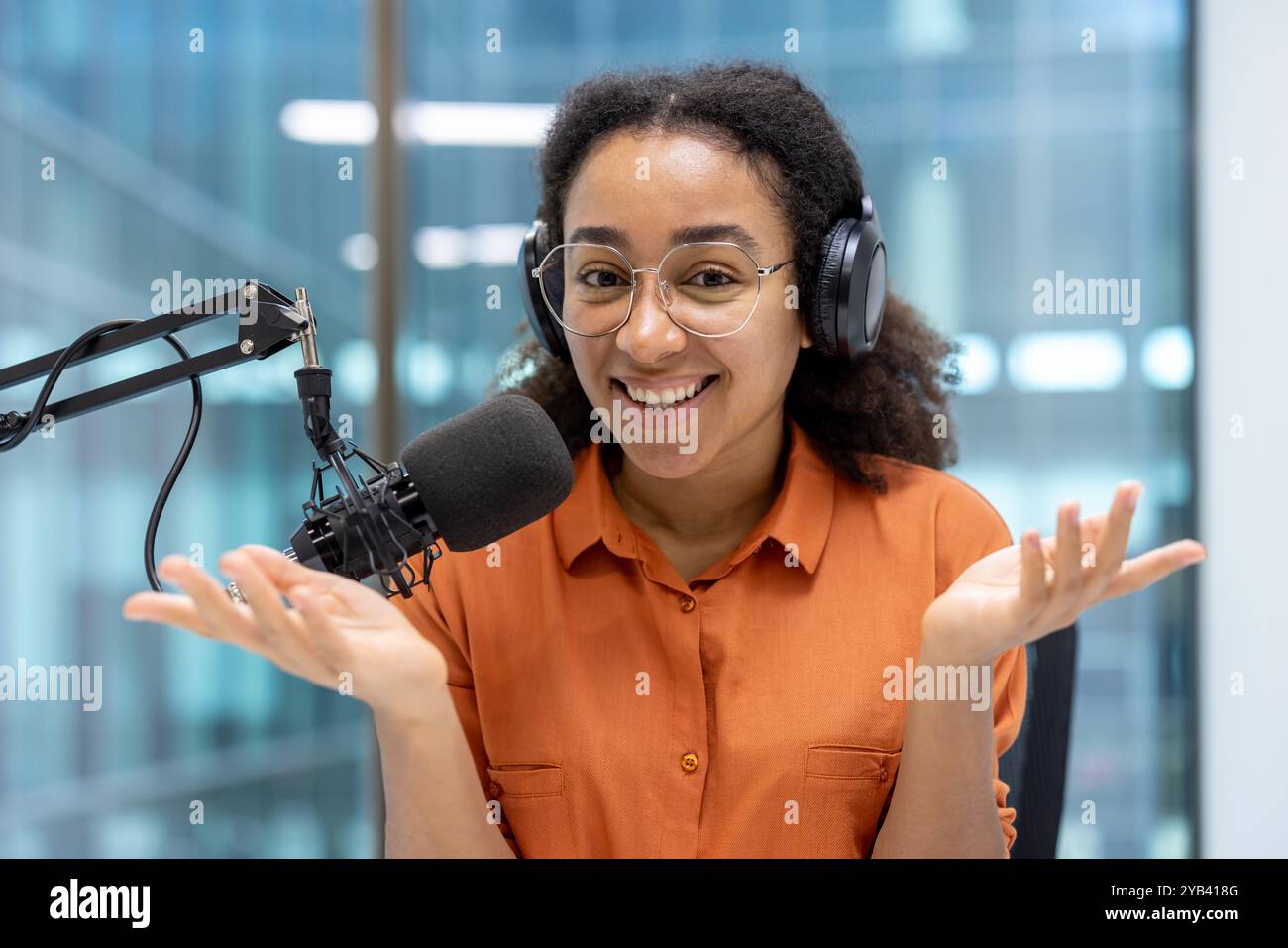 Female podcast host gestures speaking hi-res stock photography and ...