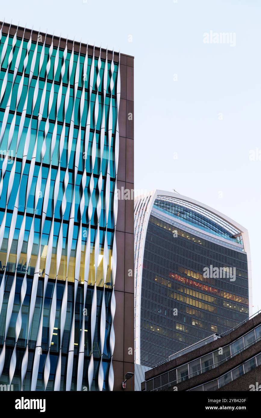 Modern financial buildings in City of London illuminated at twilight ...