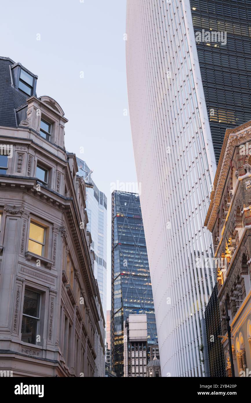 Modern financial buildings in City of London illuminated at twilight ...