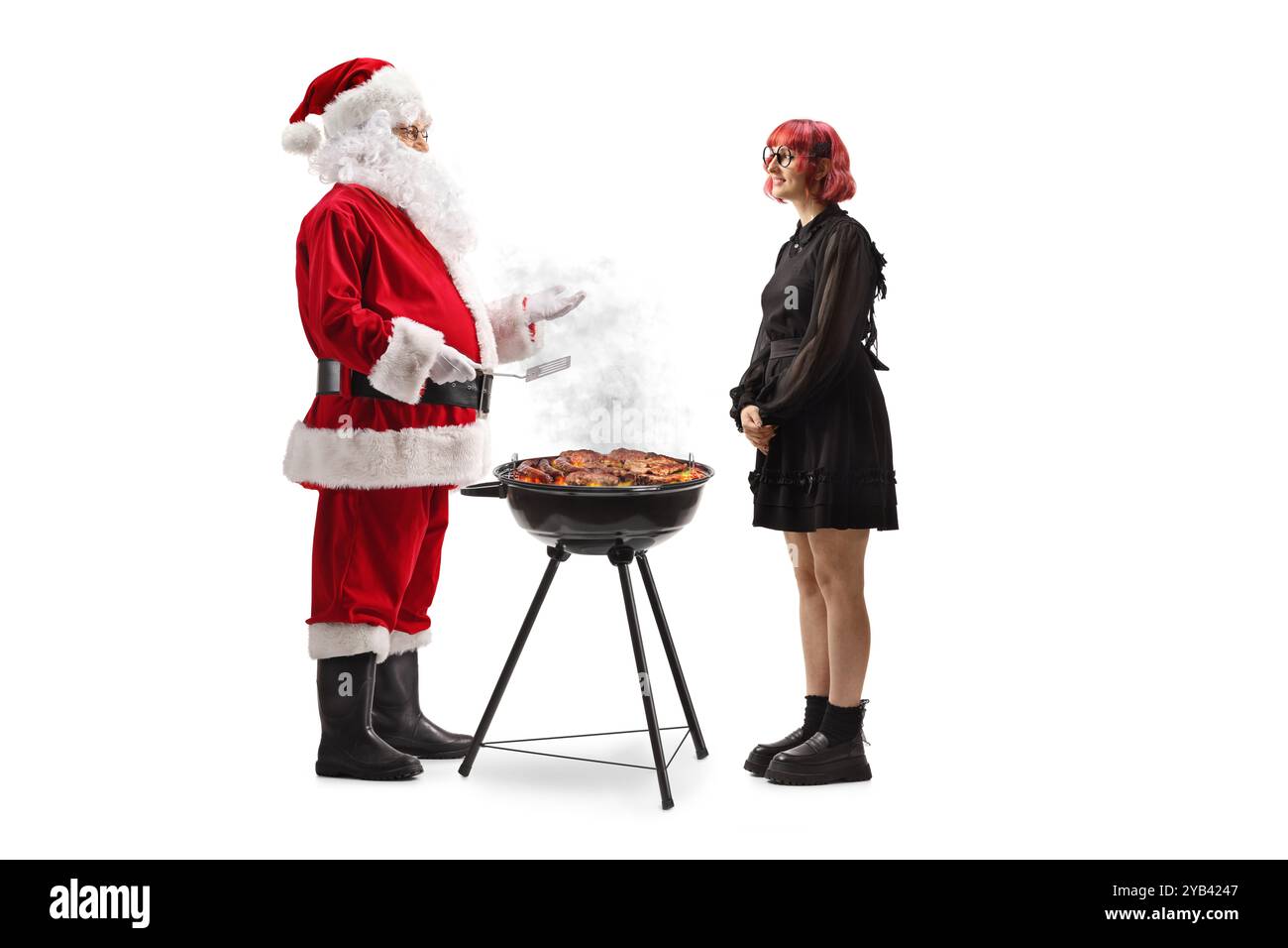 Santa claus and a young woman grilling meat on a bbq isolated on white ...
