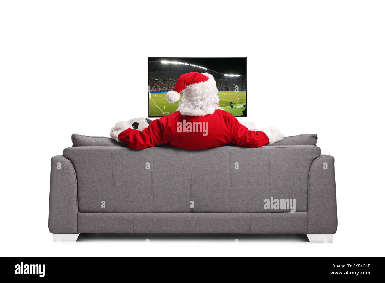 Santa claus resting on a sofa in front of tv and watching football ...