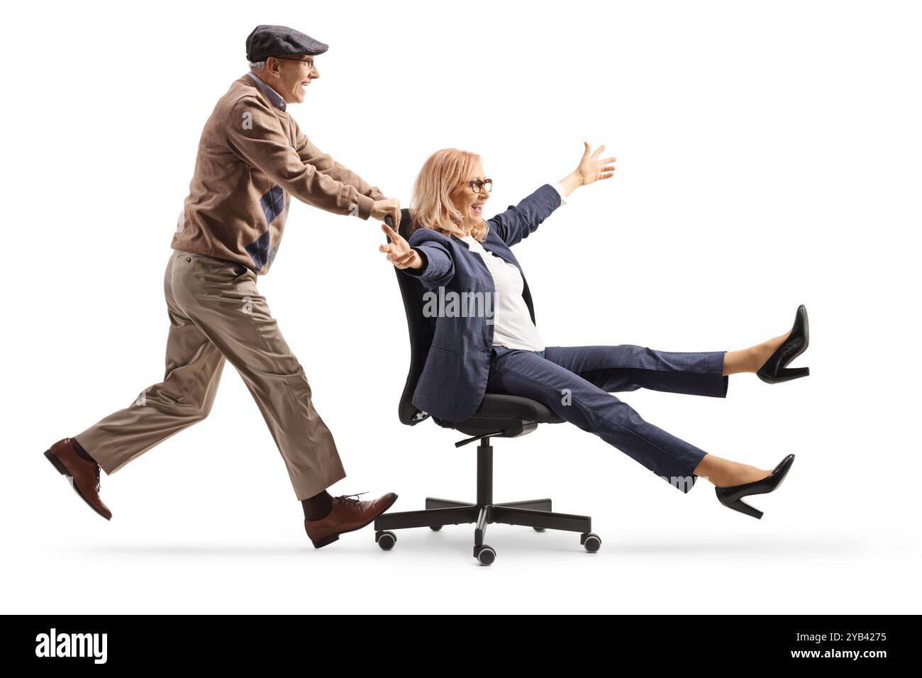 Elderly man pushing a businesswoman seated in an office chair isolated ...