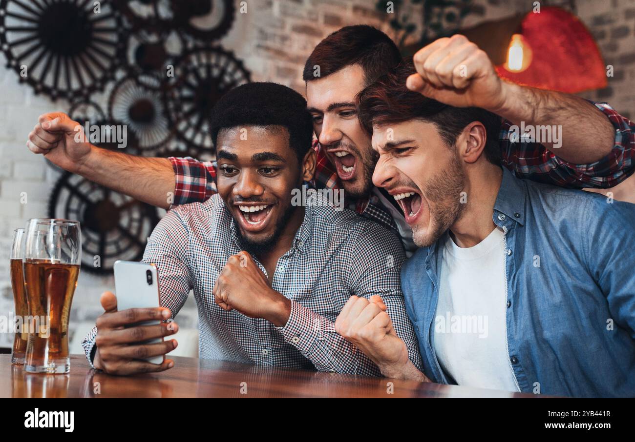 Black men watching match on hi-res stock photography and images - Alamy