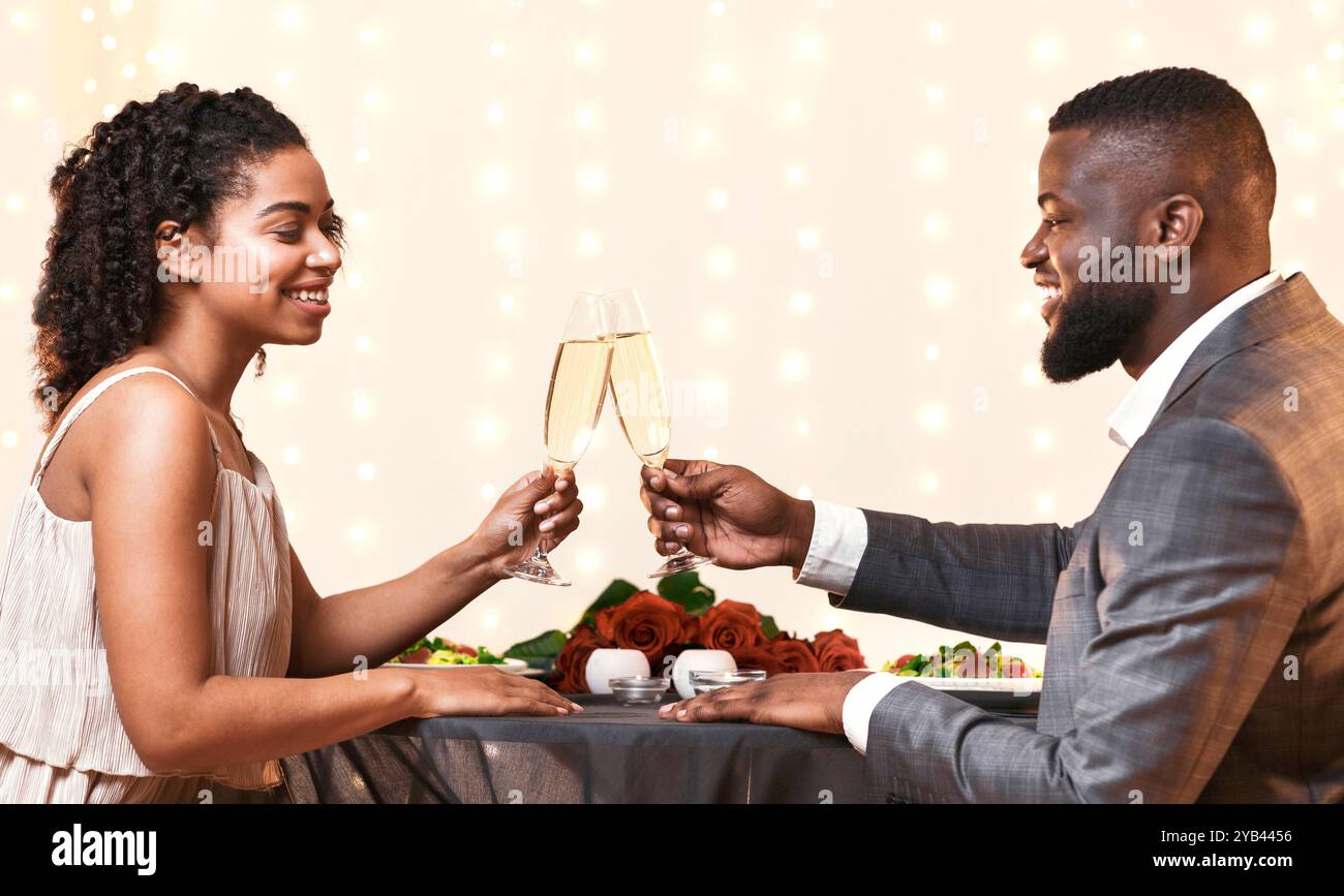 Happy afro couple having festive dinner at fancy restaurant Stock Photo ...