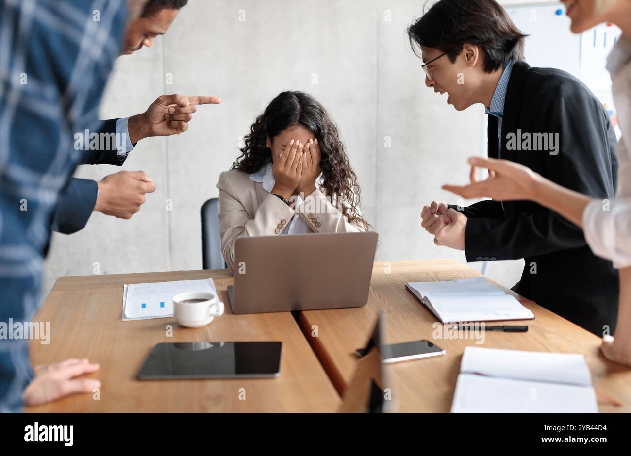 Aggressive Coworkers Yelling At Victimized Businesswoman Sitting In ...