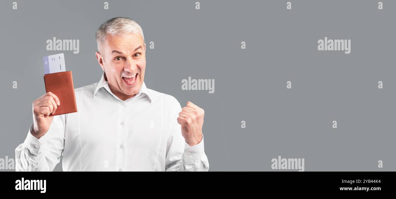 Happy senior man holding tickets and his passport Stock Photo - Alamy