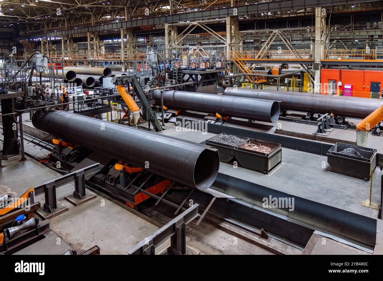 Modern seam pipe factory production line Stock Photo - Alamy