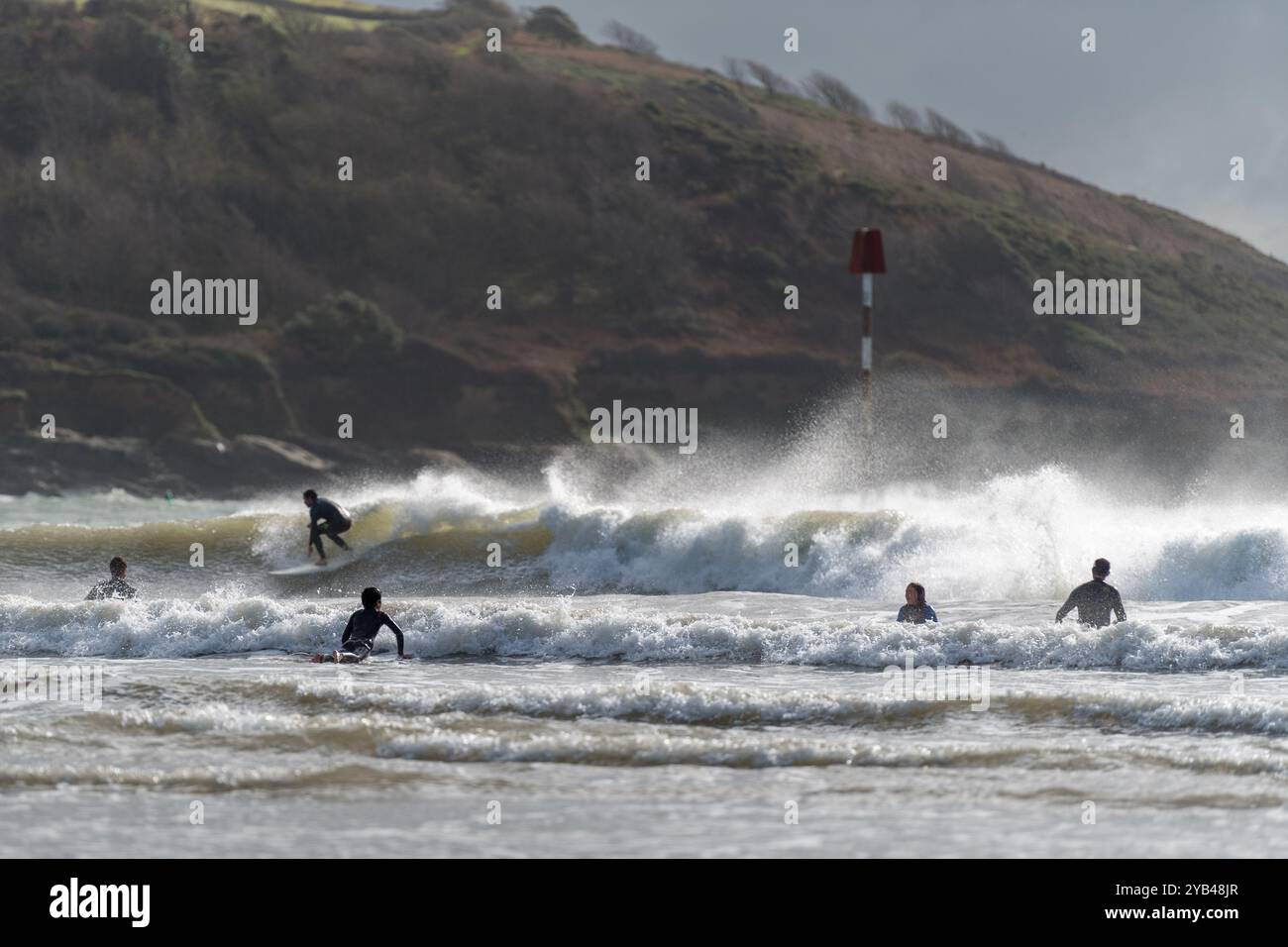 Surfers make the most of Storm Brian, catching waves coming onto North ...