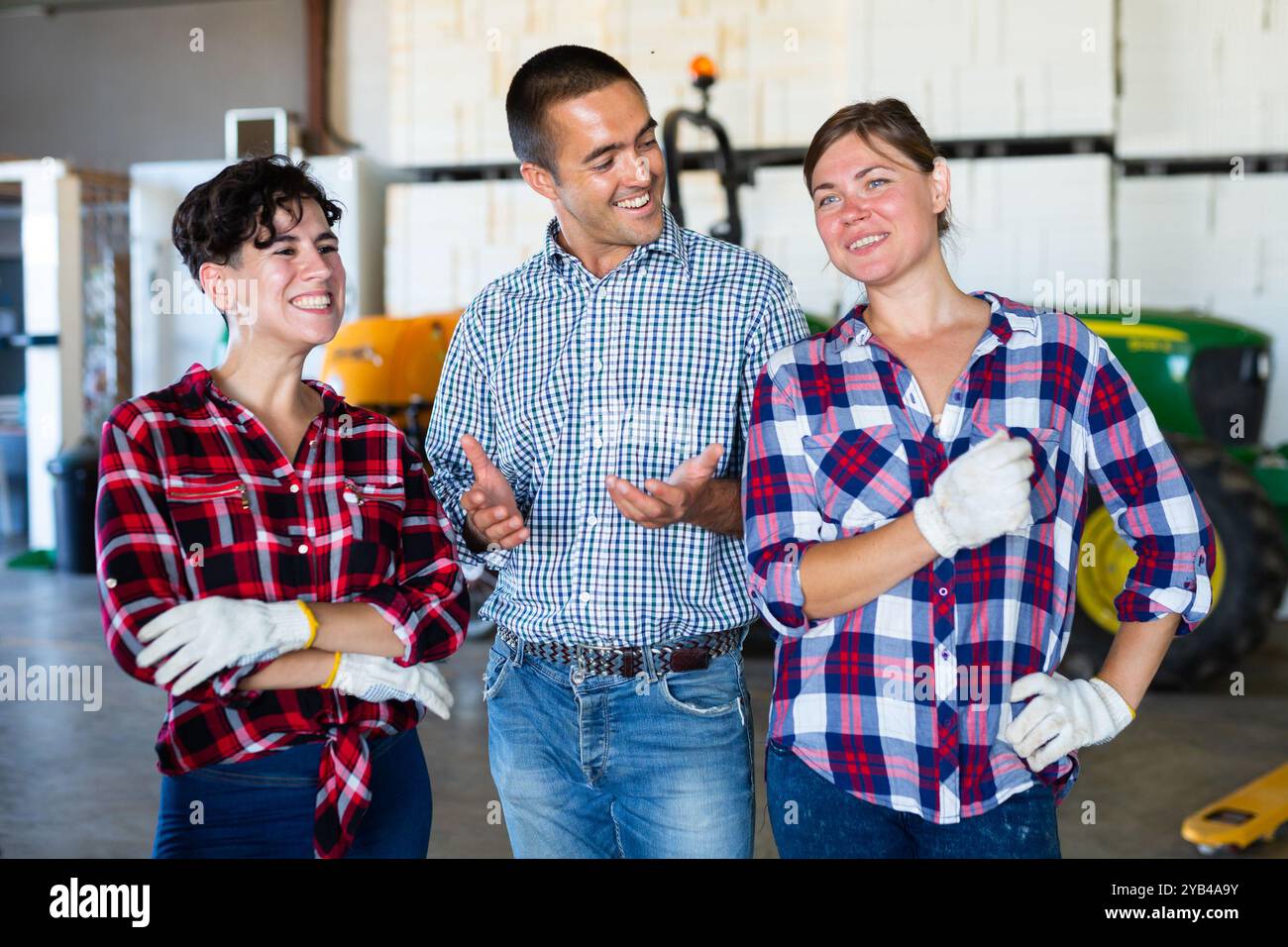 Communication of three work farmers during break from work Stock Photo ...