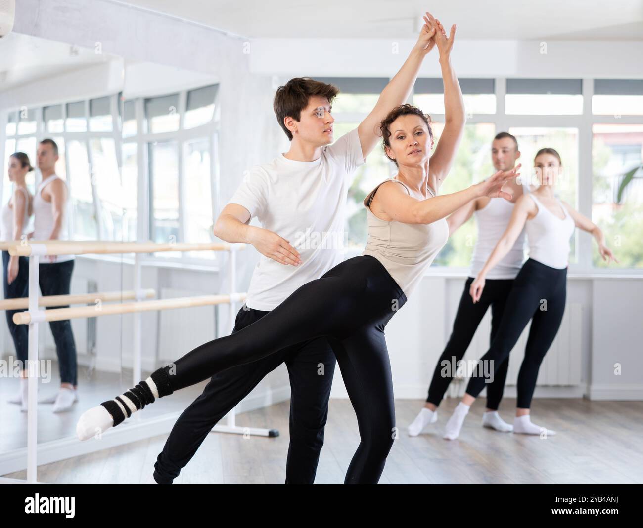 Amateur ballet partners mastering paired technique at group class Stock ...