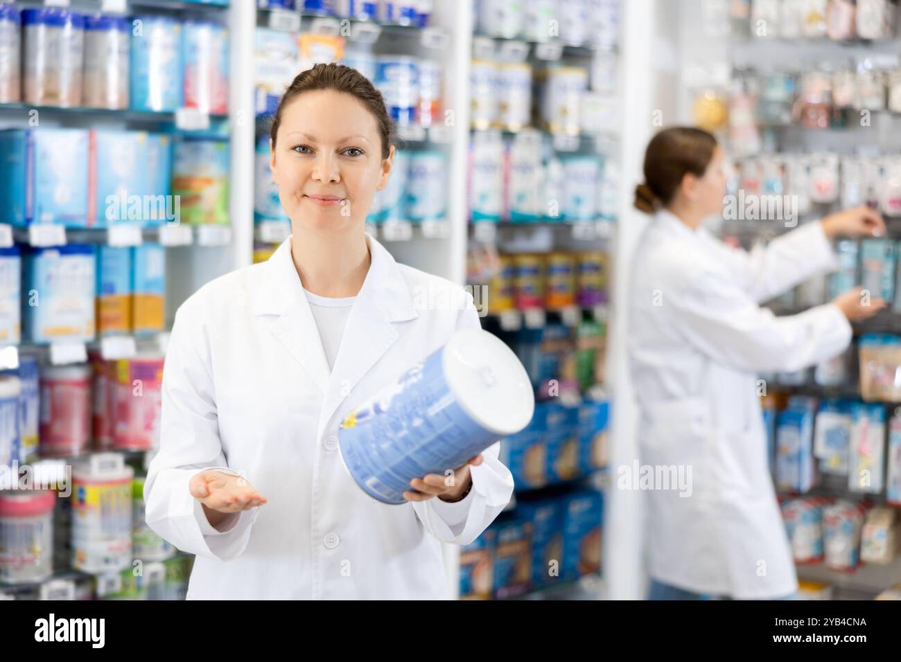 Portrait of female pharmacist in sales hall of a pharmacy ...