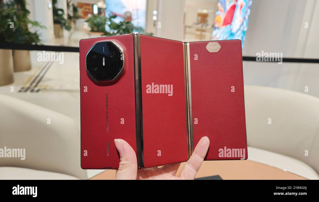 SHANGHAI, CHINA - OCTOBER 15, 2024 - A customer experiences Mate XT, a ...