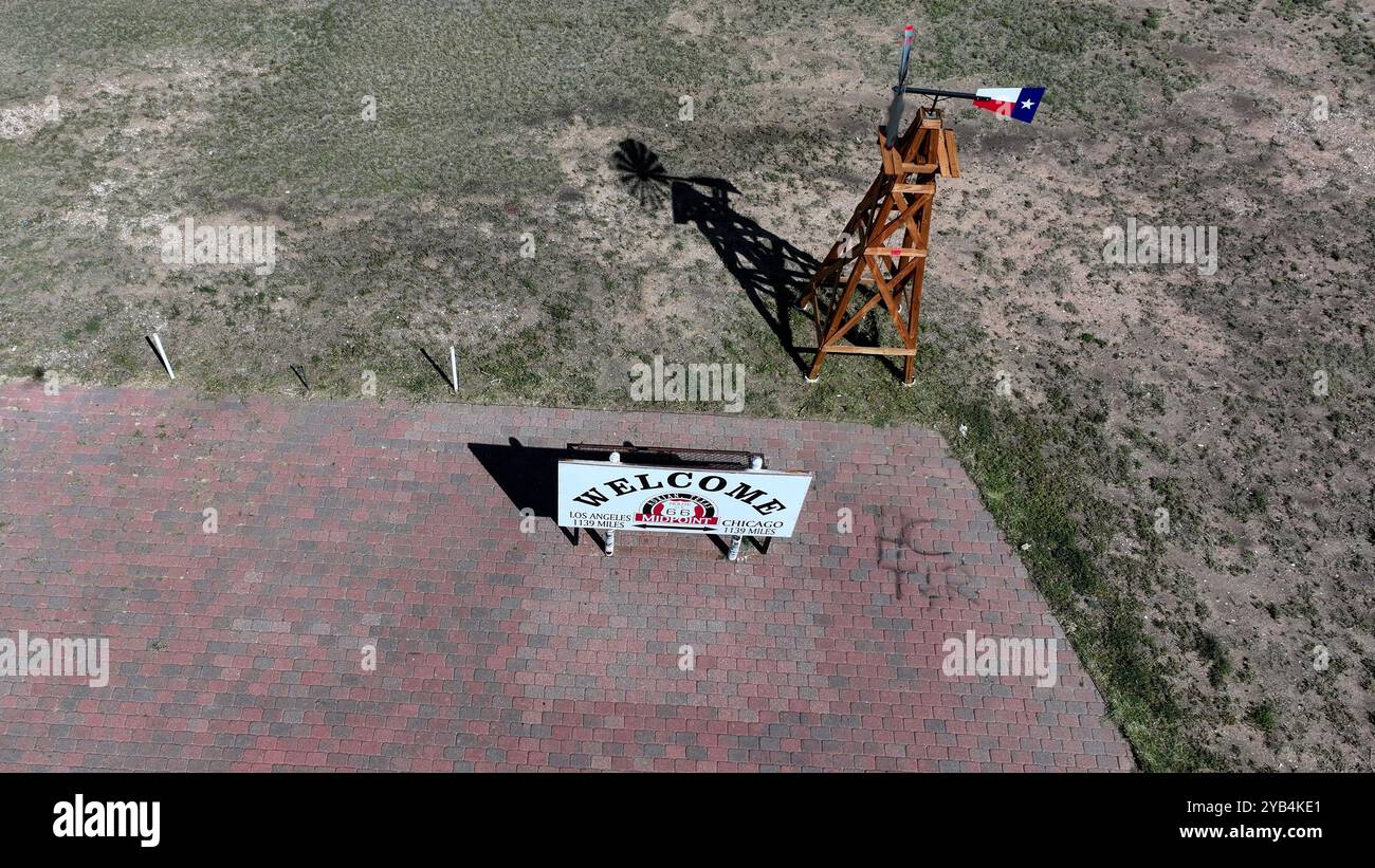 Aerial view of sign and monument marking the halfway point on Route 66 ...