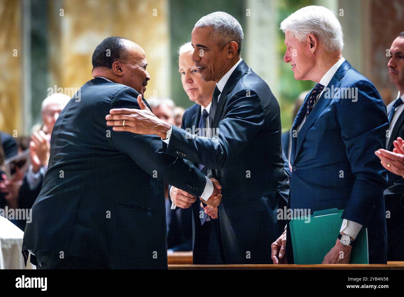 Martin Luther King III (L) greets former president Barack Obama (C ...