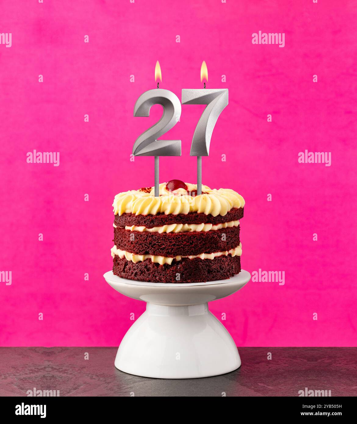 Birthday cake with number 27 candle - Red velvet on a fuchsia ...