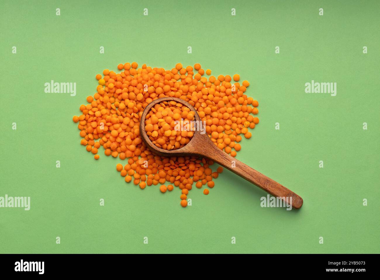 Lens culinaris organic - Red lentils on the spoon Stock Photo - Alamy