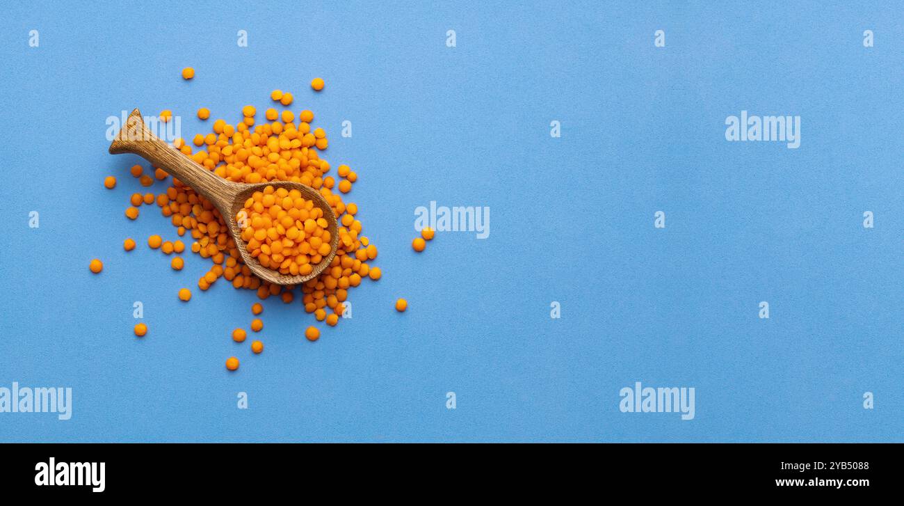 Organic red lentils on the spoon - Lens culinaris Stock Photo - Alamy