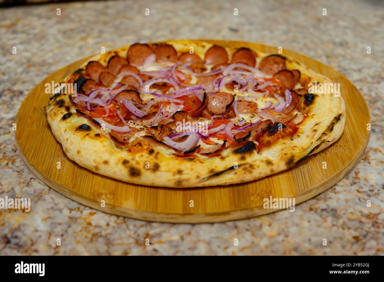 Rustic artisanal pizza in a cozy atmosphere Stock Photo - Alamy