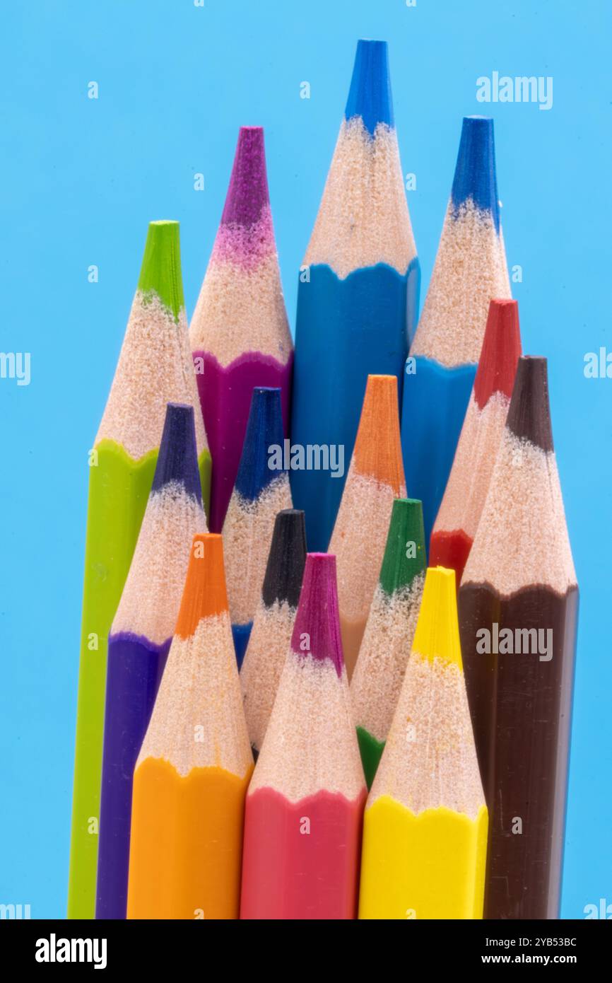 This image displays a collection of colored pencils with sharpened tips ...