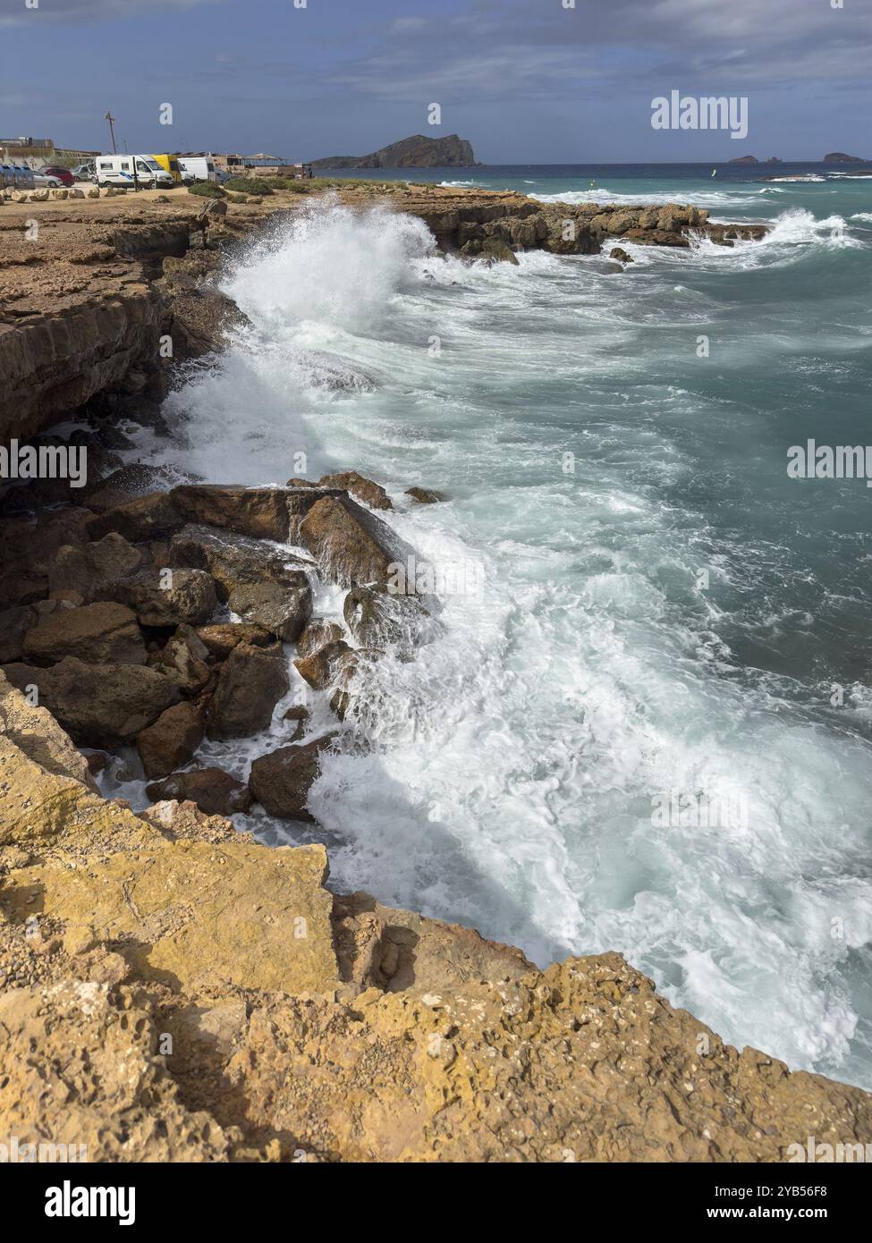 Coastal landscape with roaring waves crashing against rocky shores ...