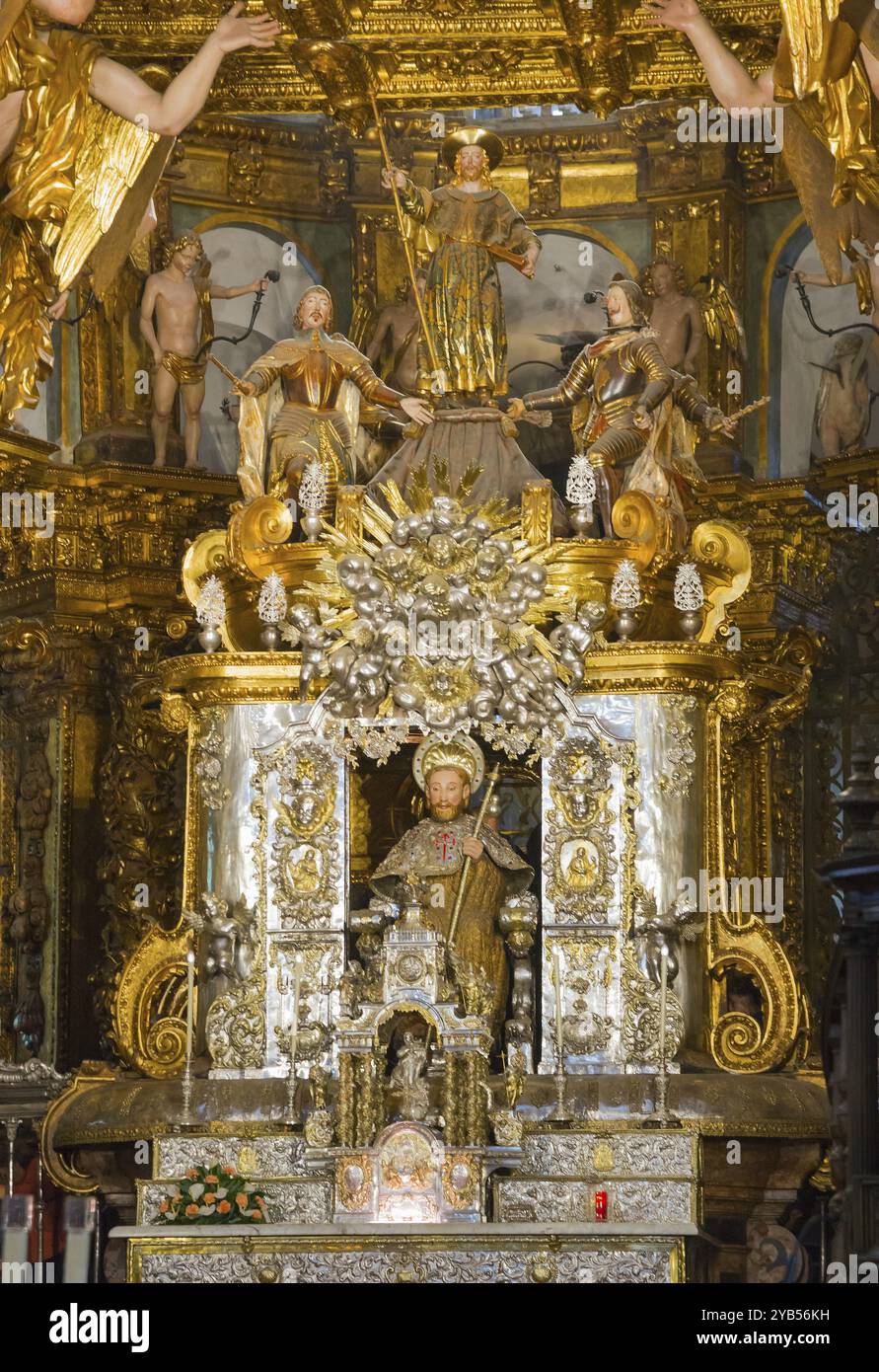 Detailed, baroque statue scene with figure of a saint on a richly ...