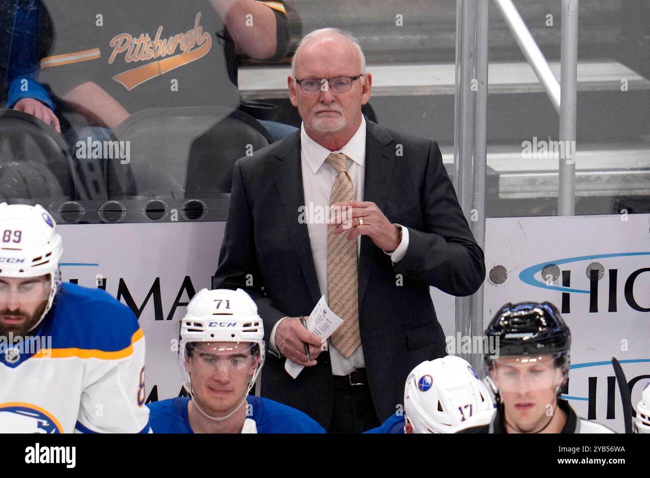 Buffalo Sabres head coach Lindy Ruff stands behind his bench during the ...