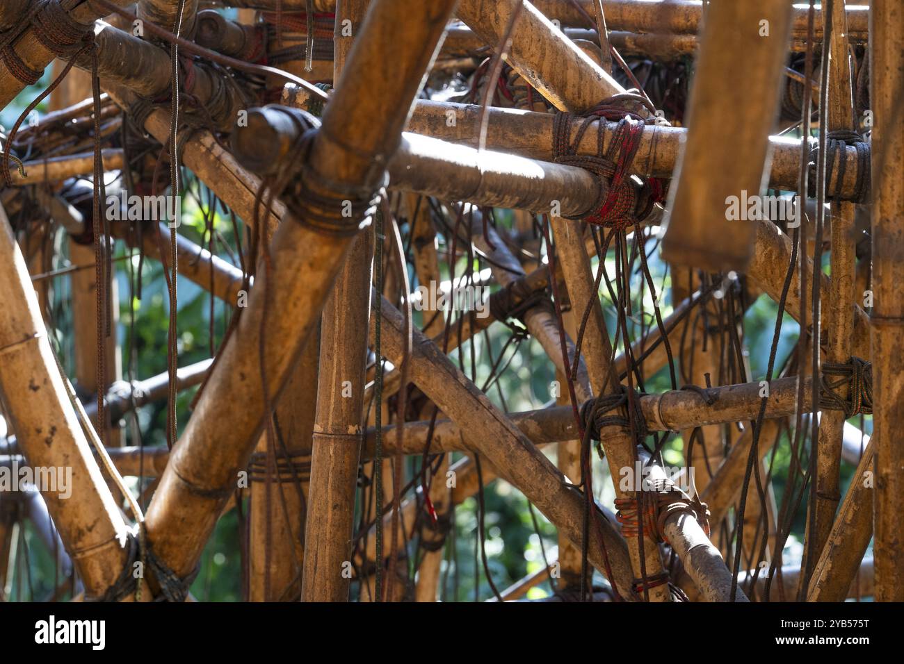 Close-up of a complex bamboo installation with ropes, bamboo sculpture ...
