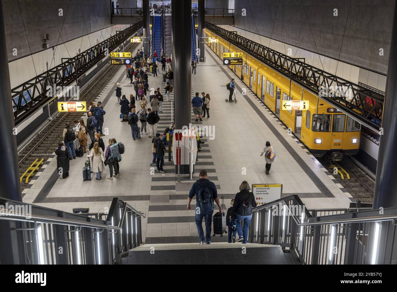 Berlin Central Station underground station. Platform with passengers on ...