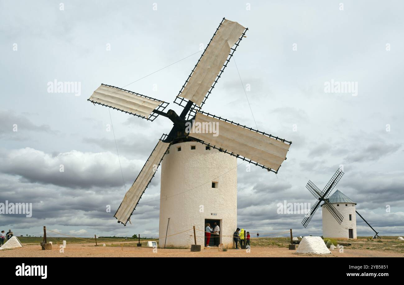 Large white windmills in an open landscape with dramatic skies and ...
