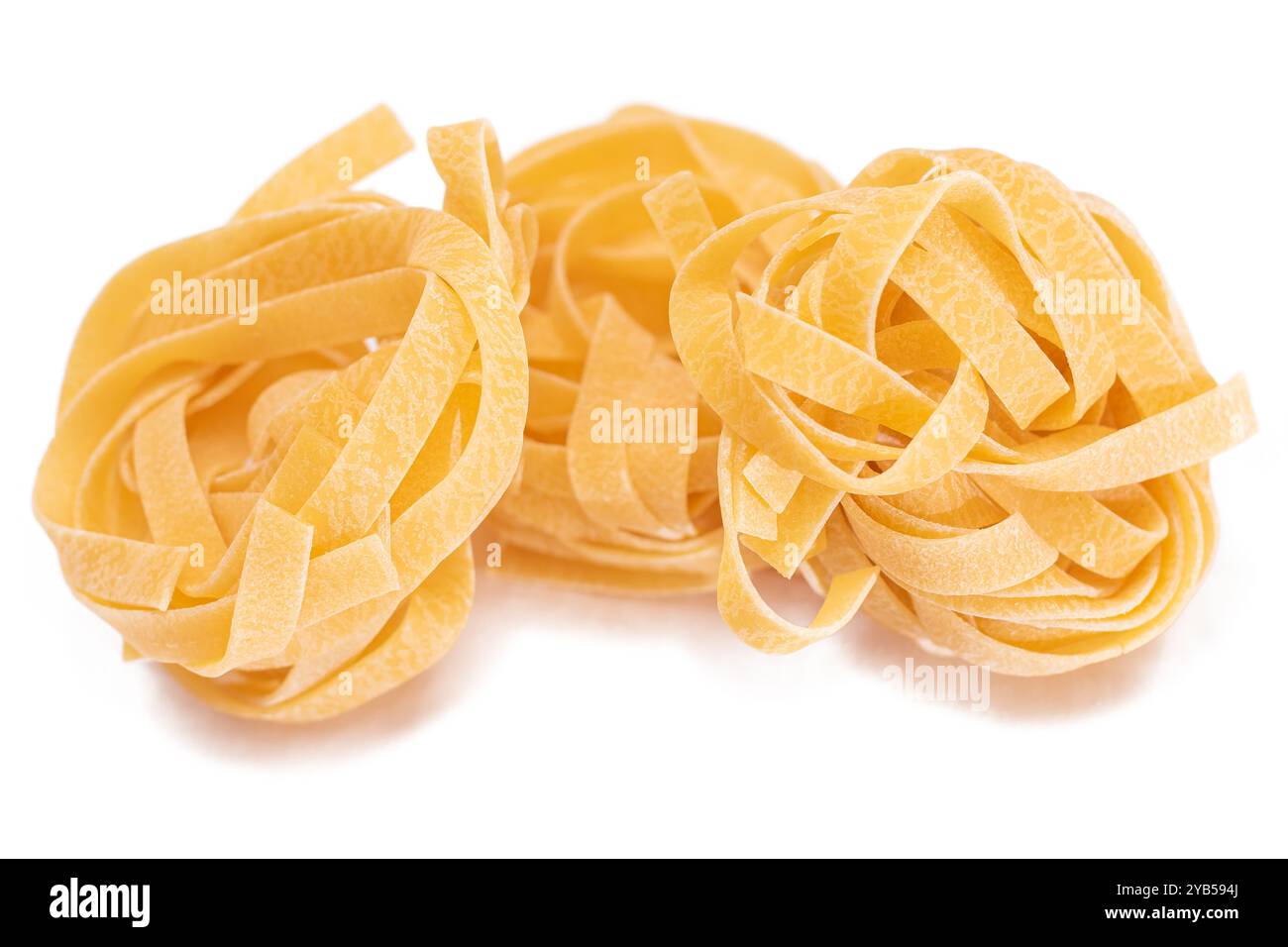 Three Classic Italian Raw Egg Fettuccine - Isolated on White Background ...