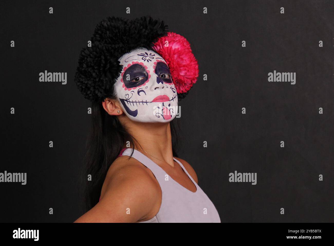 Mexican teenage woman with skull or catrina makeup and flower crown ...