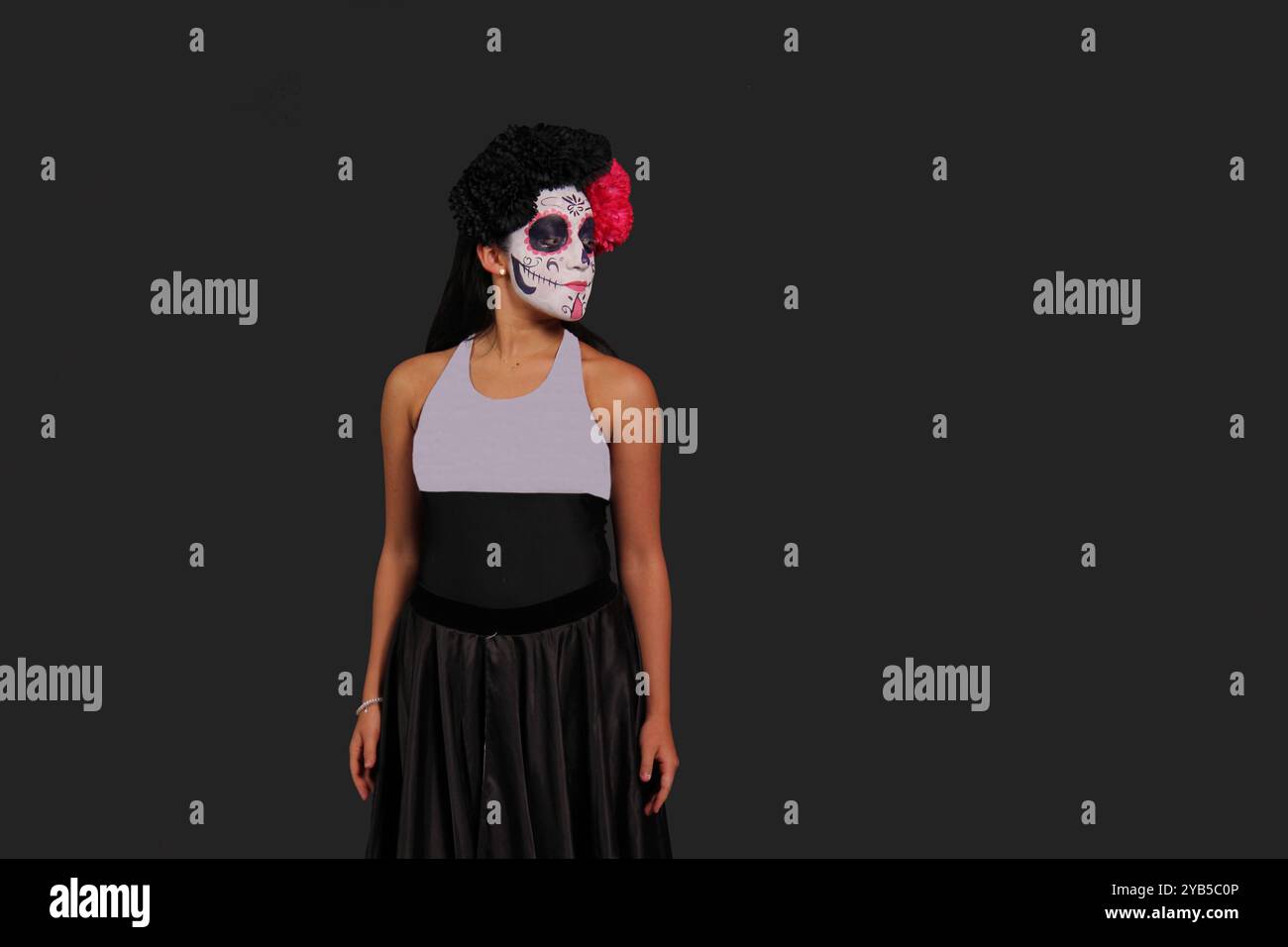 Mexican teenage woman with skull or catrina makeup and flower crown ...