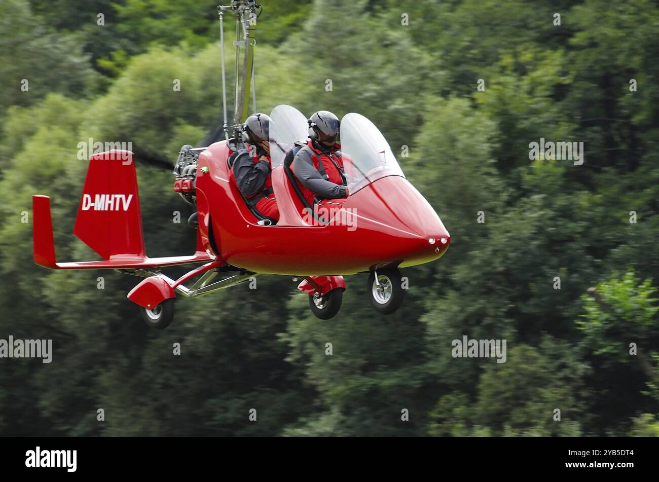 Red gyrocopter on landing approach Stock Photo - Alamy