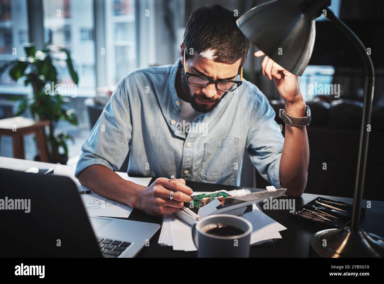Engineer, laptop and man with circuit, office and repairing of ...