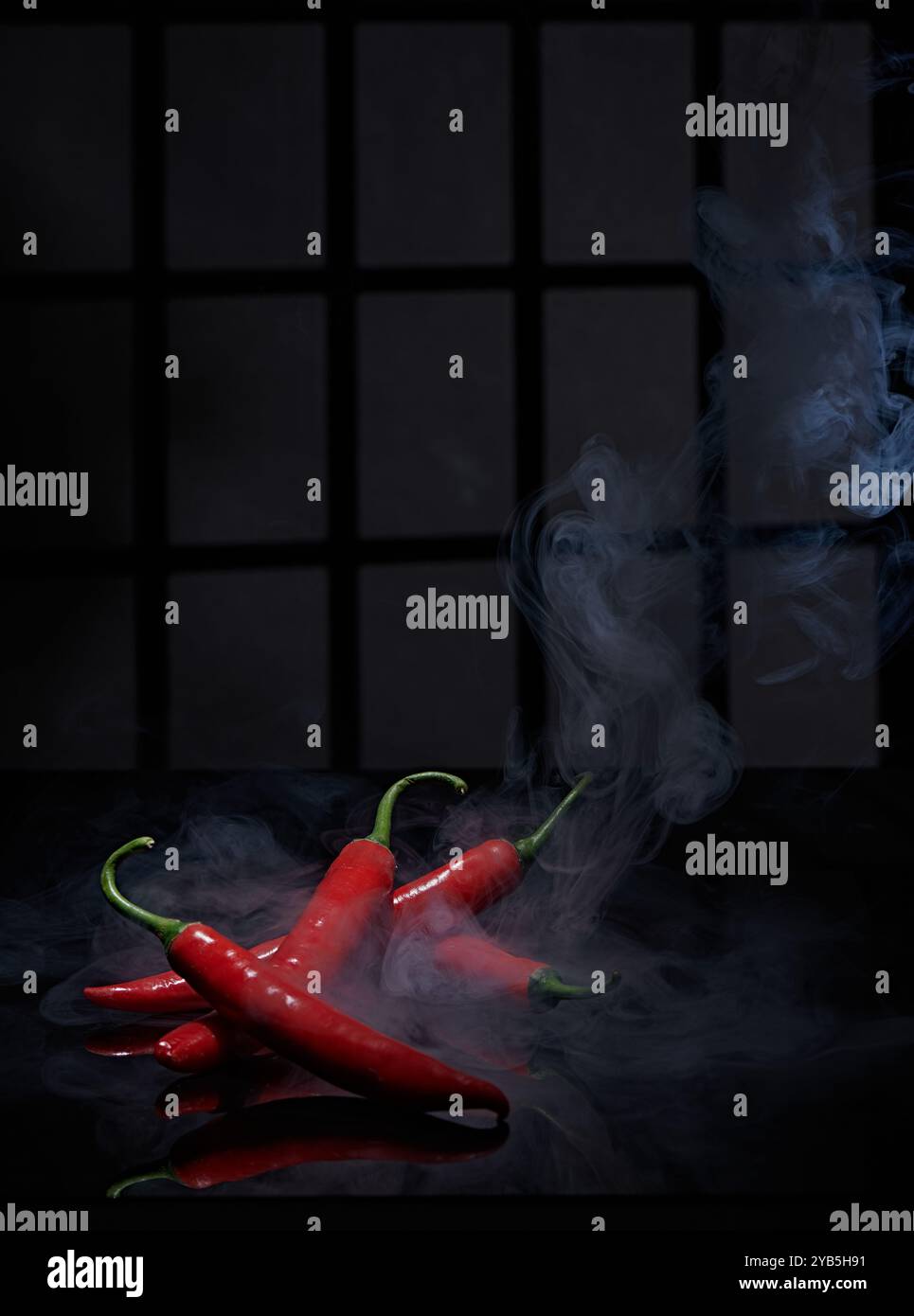 Photo of chili with dark window background Stock Photo - Alamy