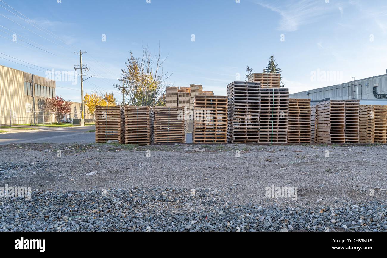 Stacks of wood pallets in a factory Stock Photo - Alamy