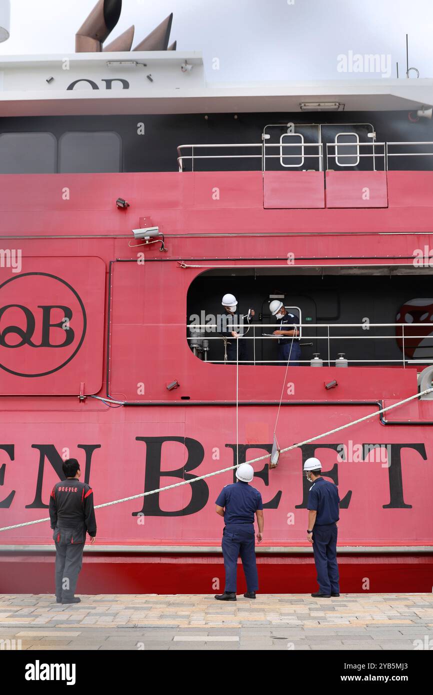 Fukuoka Coast Guard staffs inspect the Queen Beetle, high-speed ferry ...