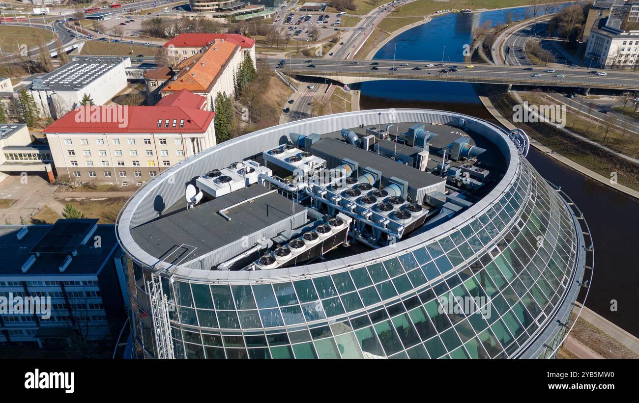 Aerial view of a modern building's rooftop with HVAC systems and ...