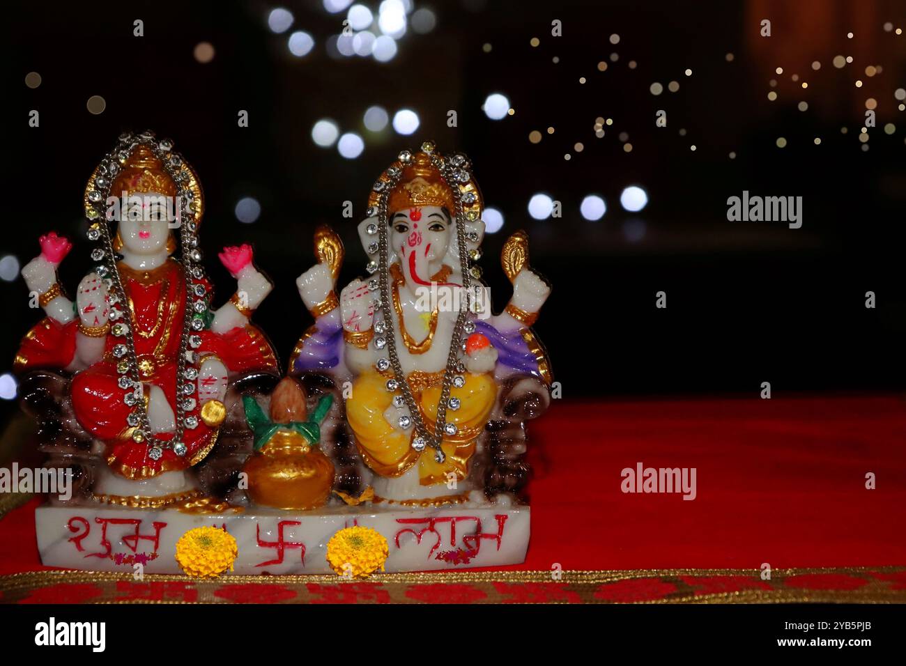 Decorated Lord Ganesha, Goddess Lakshmi idol with kalasha pot, Shubh ...
