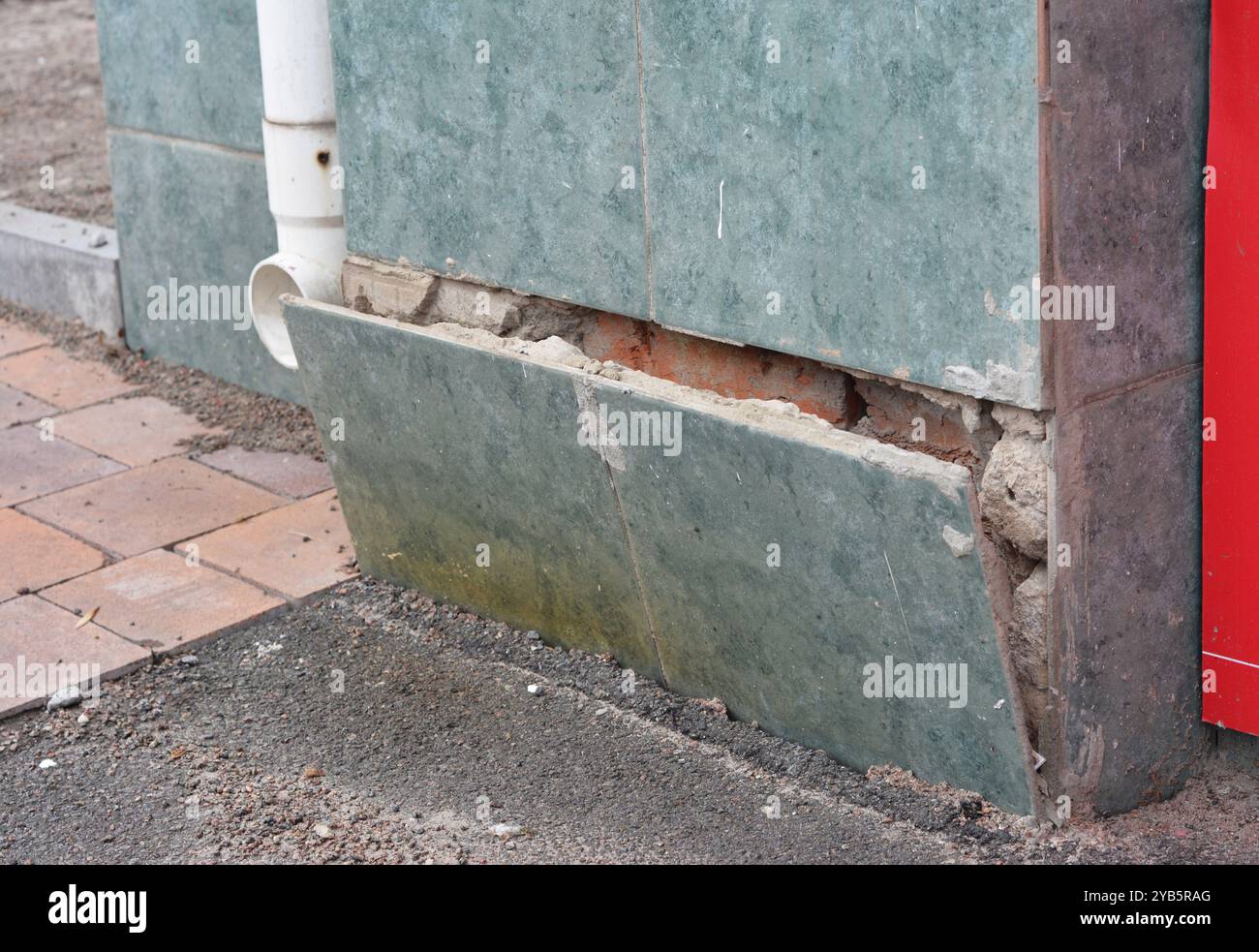 House foundation repair caused by damp from rain gutter downspout pipe ...