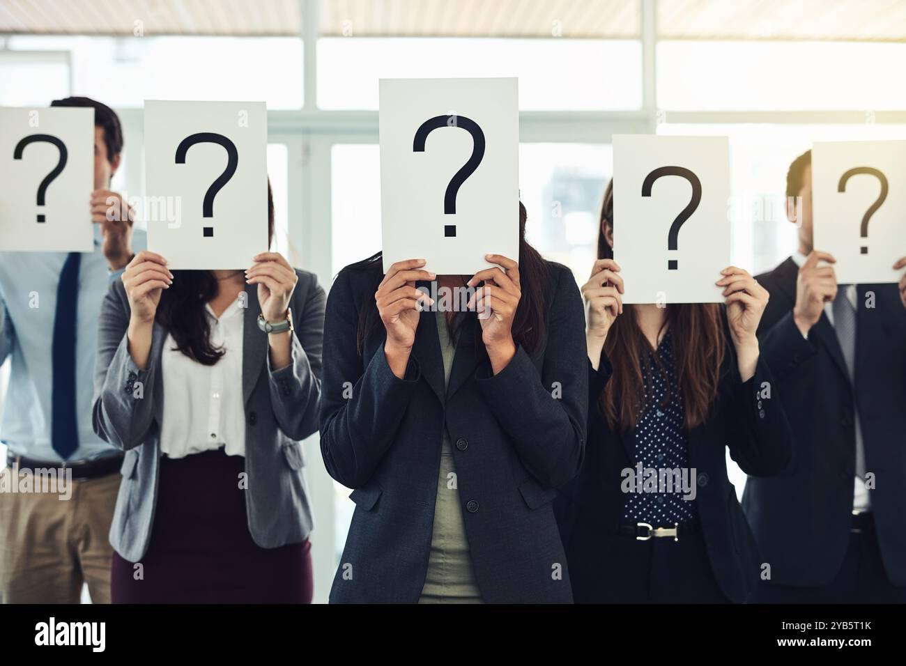 Question mark, group and paper in office, business and colleagues with ...