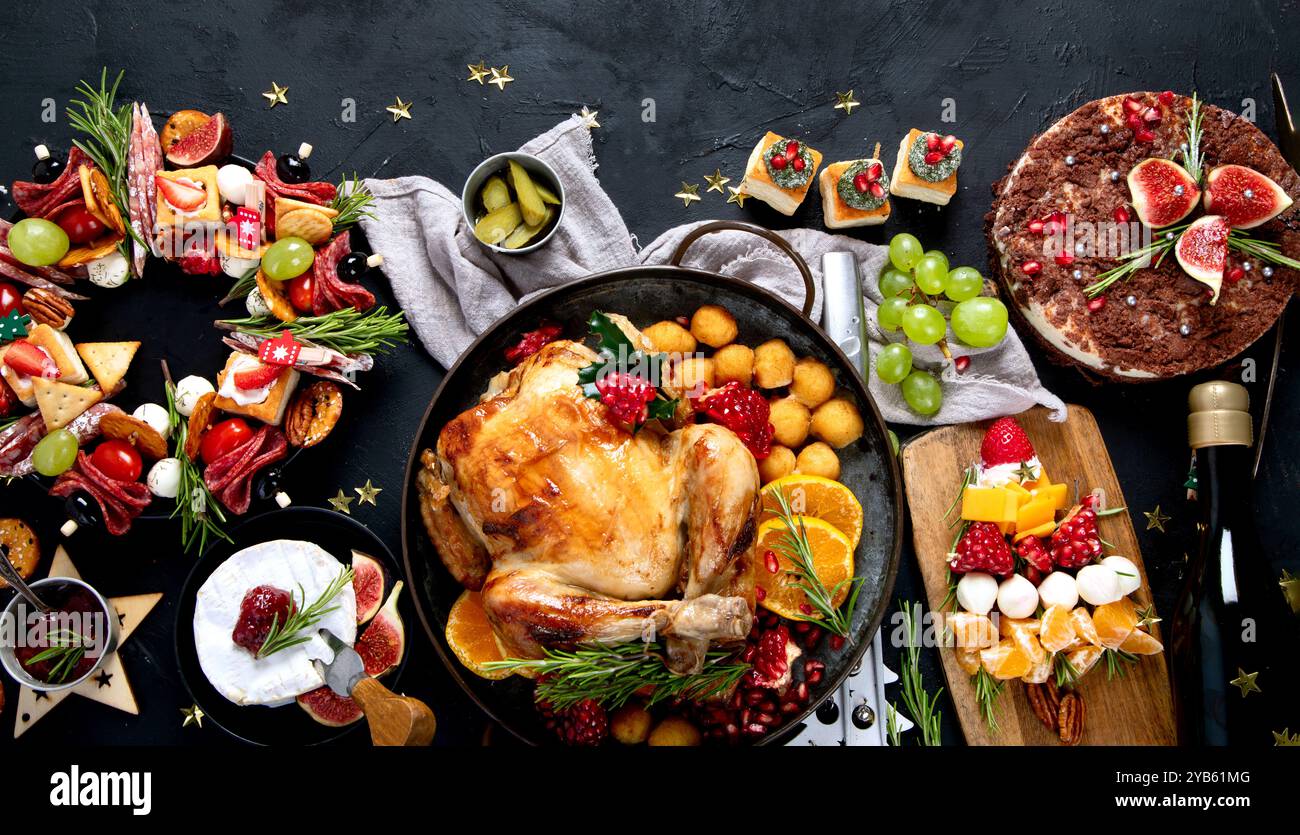 Christmas dinner with roast chicken, christmas wreath, tree, cake ...