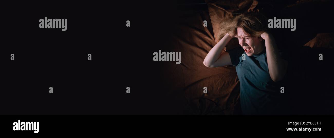 stressed woman screaming while having nightmares and panic attacks at ...