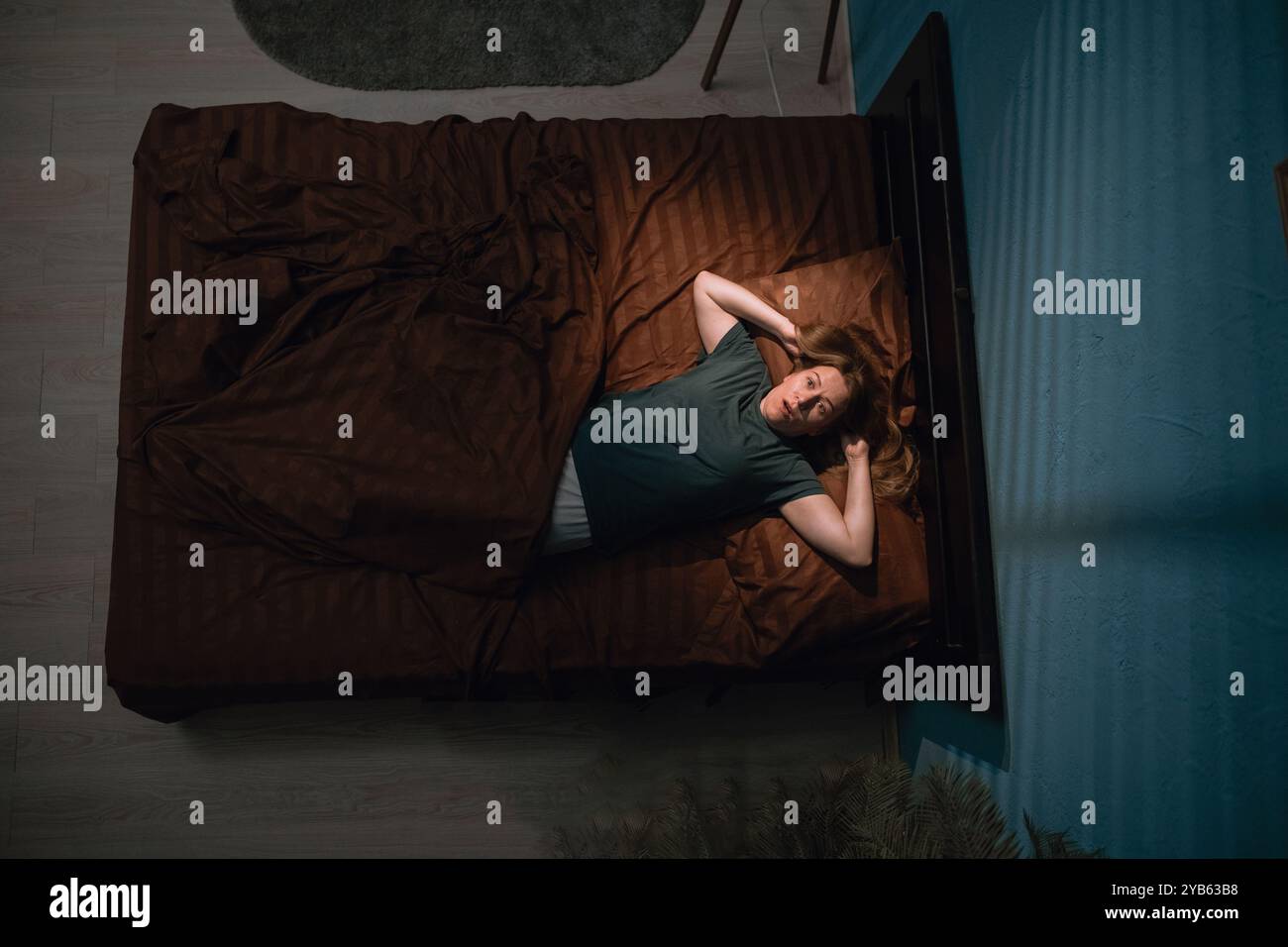 Shocked woman had a terrible nightmare, wake-up in horror with big eyes ...