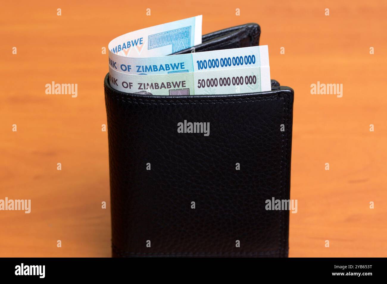 Old Zimbabwean money - dollar in the black wallet Stock Photo - Alamy